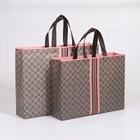China Logo Printed Gilding Striped Apparel Paper Bag Packaging For Clothes for sale