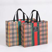 China Logo Printed Gilding Striped Apparel Paper Bag Packaging For Clothes for sale