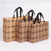 China Logo Printed Gilding Striped Apparel Paper Bag Packaging For Clothes for sale