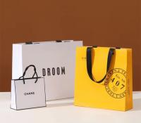 China Shoes Custom Paper Shopping Bags Bronzing Silver 250gsm Ivory Favour Bags for sale