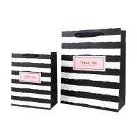 China 128-250gram Black Handle Laminated Art Paper Bag For Apparel Advertising for sale
