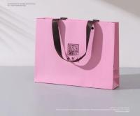 China Grosgrain Handle Matte Black Paper Bag Gold Hot Stamping Retail Paper Shopping Bag for sale