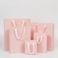 China Customized Logo 180gsm-500gsm Boutique Paper Bag With Handles for sale