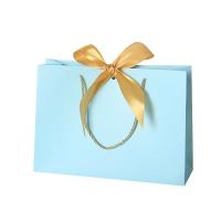 China Ribbon Handle Cosmetic Paper Bags for sale