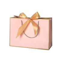 China Ribbon Handle Cosmetic Paper Bags for sale
