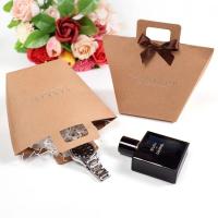 China Custom Logo White Kraft Present Paper Bags 9.5*9*12cm French Gift Bag With Ribbon for sale