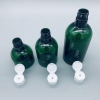 China Dark Green Empty Wholesale 50ml 100ml 150ml Round Custom Shampoo Bottle PET Cosmetic Plastic Pump Bottle for sale