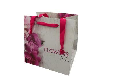 China Custom Eco-Friendly Paper Gift Bags 80g-350g Material with Multiple Handle Options for Birthday Parties and Promotional Use for sale