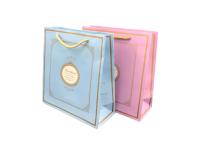 China Custom Paper Gift Bags 157-350g Material with Multiple Handle Options - 3,000pcs MOQ for sale