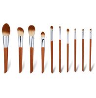 China 10-Piece Orange Aluminum Ferrule Makeup Brush Set with Soft Synthetic Bristles for sale