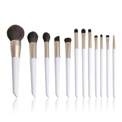 China Custom Logo White Luxury Makeup Brush Set 12Pcs Super Dense Powder Foundation Brush Synthetic Vegan Hair for sale