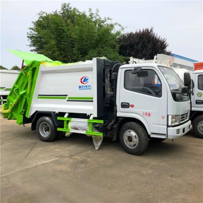 China Hydraulic Waste Compactor Garbage Truck 7m3 4*2 Manual Transmission for sale