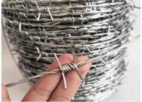 China Hot Dipped Galvanized 10mm Coiled Barbed Wire Roll   Higher Versatility for sale