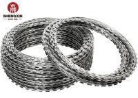 China Anti Climb 1.6Mm 500M 25Kgs/Roll Barbed Tape Concertina Wire For Protection for sale