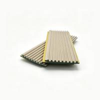 China Solid Core PVC Fluted Wall Panels 102x12mm Wood Grain Slat Interior Cladding Design for Hidden Door Applications for sale