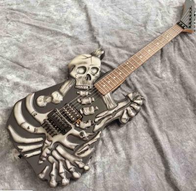 China Custom Skull Carving Body 6 Strings Electric Guitar Maple Neck Matte Black 22 Frets for sale