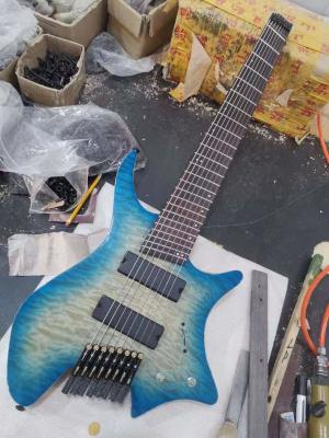 China 8string headless guitar ash body quilted maple top fanned fret for sale