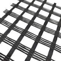 China Fiberglass Geogrid for Strength Roadbed Reinforcement White Asphalt Coated Geogrid for sale