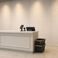 China Warm White Brick Effect SPC Wall Panels for Convenience Store and Retail Interior for sale