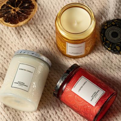 China Yellow / Red / White Soy Scented Candle Embossed Glass Jar Candles For Private Label OEM for sale
