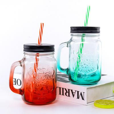 China Custom Design Logo embossed colored juice drink glass mason jar with handle and lid for sale