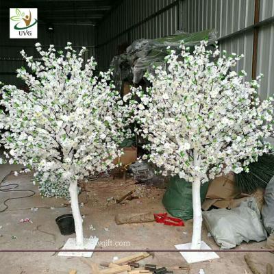 China Artificial Peach Blossom Centerpiece Tree 60cm UVG White Pink Wedding Table Decoration for sale