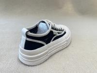 China Women black and white sneakers with breathable mesh and mid top for sale