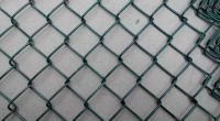 China Galvanized PVC Coated Chain Link Fence 5x5cm Hole 1.8m Height 25m Length for sale