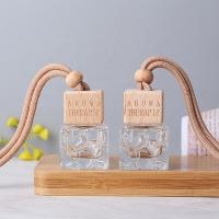 China 7ml Square Honeycomb Glass Hanging Car Air Freshener Bottle With Wood Lid Brown Rope for sale