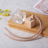 China 7ml Square Honeycomb Glass Hanging Car Air Freshener Bottle With Wood Lid Brown Rope for sale