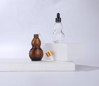 China Empty Amber Glass Bottle Double Gourd Flat Shaped Glass Dropper Serum Bottle 30ml for sale