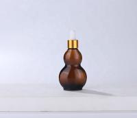 China Empty Amber Glass Bottle Double Gourd Flat Shaped Glass Dropper Serum Bottle 30ml for sale