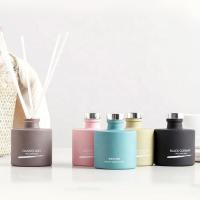 China 200ml Round Glass Reed Diffuser Bottles Matte Black Matte Blue Custom Logo Printed for sale