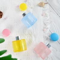 China Fancy Reed Diffuser Bottles 100ml Round Shape Glass Bottle For Home Fragrance for sale