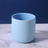 China Cylinder Luxury Candle Jars Matte Empty Geometric Ceramic Candle Jars With Lids for sale