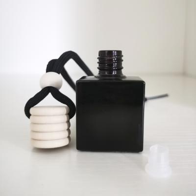 China 8ml Black Glass Car Perfume Bottle with Wooden Lid for sale