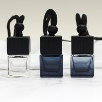 China 8ml Black Aroma Diffuser Bottle Diffuser Glass Hanging Perfume Bottle With Black Wood Lids for sale