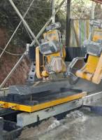 China Dual-Blade Arc-Slab Automatic Edge Trimming Machine 600-800mm 2500mm Travel CNC Stone Cutter for sale
