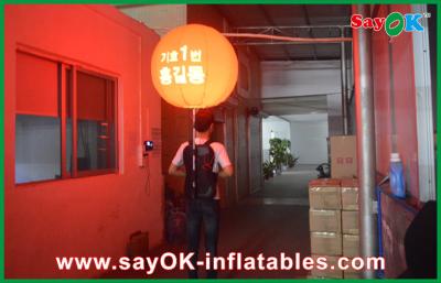 China Orange Inflatable Walking Backpack Ball 190T Polyester Party Decoration with LED Lights for sale