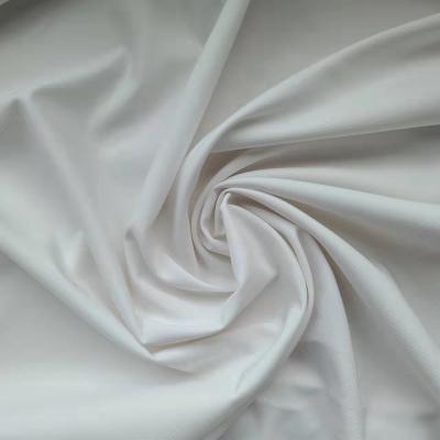 China 140-160gsm Polyester Spandex Fabric 150cm Cationic Woven Diamond Dobby for sale
