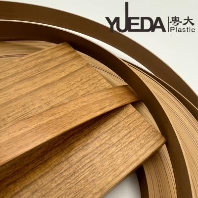 China Water Resistant Wood Grain PVC Edge Banding - Customizable Thickness & Length for Furniture Manufacturing for sale