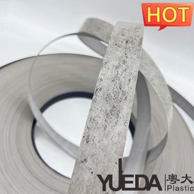 China Wood Grain Heat Resistant PVC Edge Banding with Hot Melt Adhesive for Furniture and Cabinet Edge Protection for sale