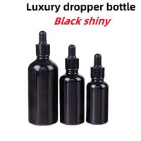 China Black Glass Dropper Bottle 10ml 20ml 30ml 50ml Essential Oil Packaging with Childproof Cap for sale