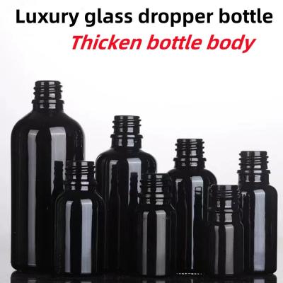 China Black Glass Essential Oil Dropper Bottle 10ml 20ml 30ml 50ml with Gold Plastic Pipette for sale