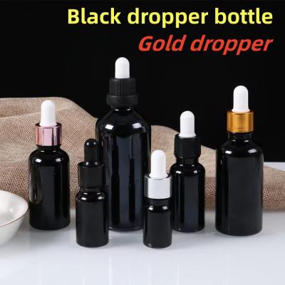 China 5ml 10ml 15ml 20ml Essential Oil Serum Flat Shoulder Round Shiny Black Glass Dropper Bottle with Pipette for sale
