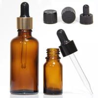 China Mini Round Glass Essential Oil Bottle 10ml 20ml 30ml 50ml with Black Plastic Dropper Cap for sale
