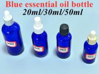 China 10ml 20ml 30ml 50ml Empty Boston Round Blue Essential Oil Glass Dropper Bottle with Dropper Cap for sale
