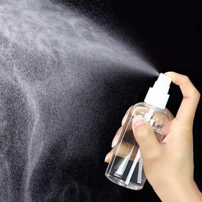 China 50ml 100ml Clear PET Plastic Spray Bottle Flat Round Travel Mini Portable Lotion Disinfectant for sale
