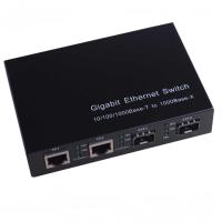 China 10/100/1000M Media Converter 4-TX + 2-FX(SC) Port Fiber Switch for sale