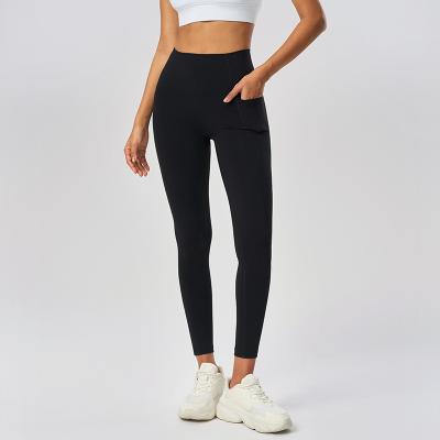 China Women's High Waisted 4 Way Stretch Yoga Leggings with Pockets Light Blue 86% Nylon 14% Spandex Moisture Wicking for sale
